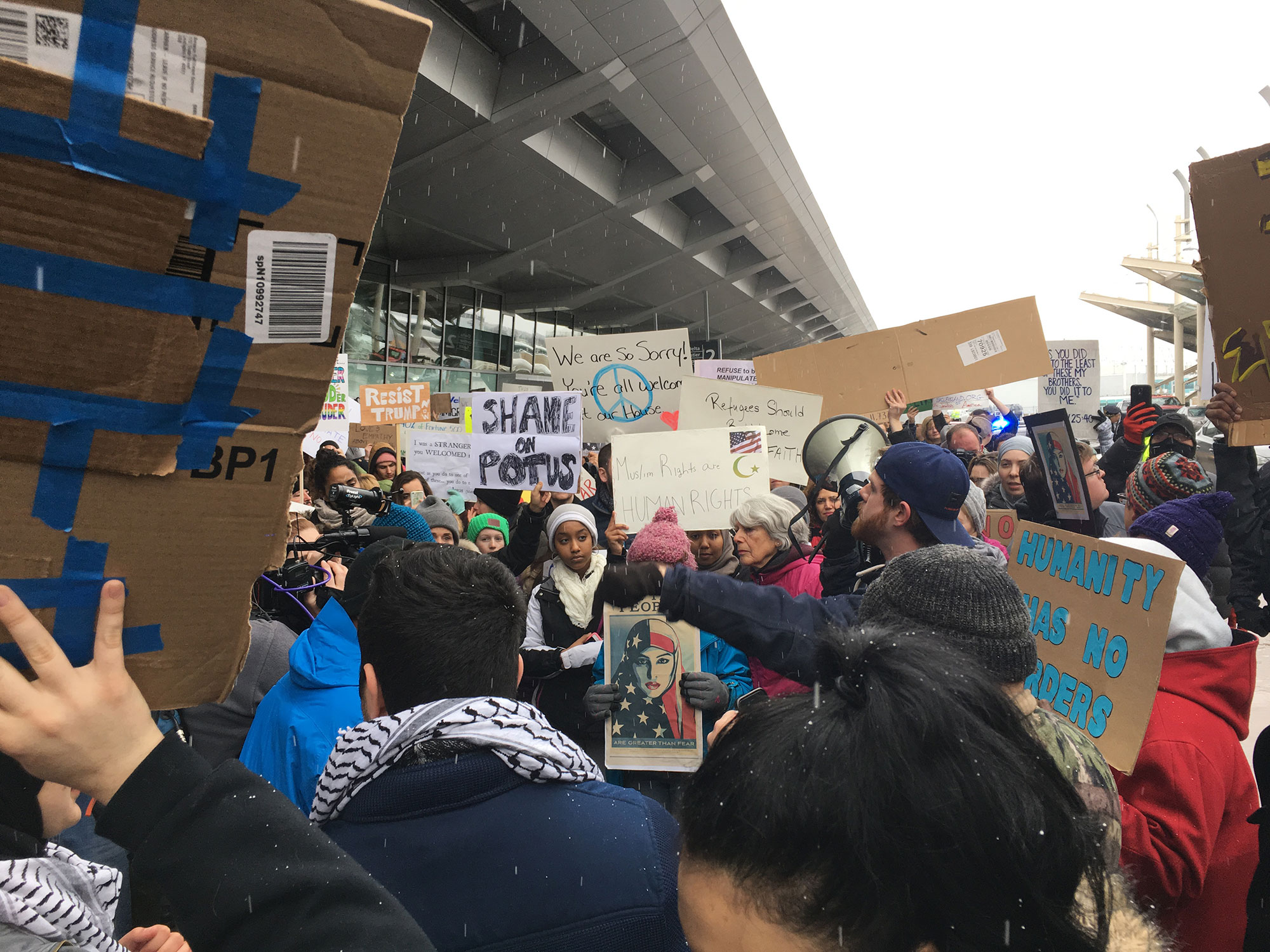 Demonstrators crowd airports, city streets, condemning Trump clampdown ...